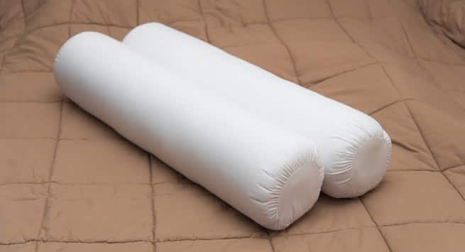 Bolsters to help beginners get into a yoga pose with ease ...
